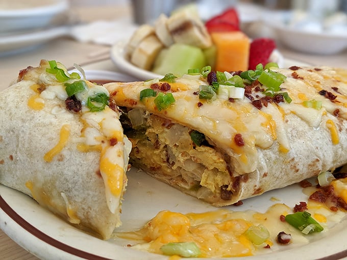 This breakfast burrito doesn't just satisfy hunger—it creates a spiritual experience. The melted cheese cascade and fresh scallions are just showing off.