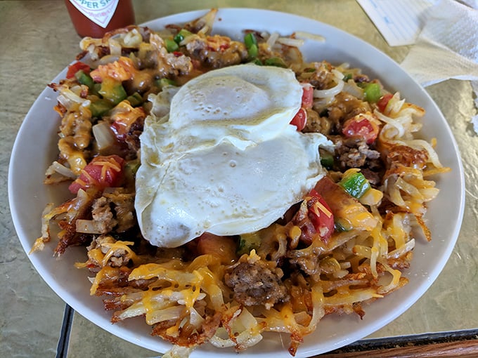 The "Trashcan" isn't what it sounds like—it's a glorious mountain of hashbrowns, eggs, and fixings that makes Marie Kondo's worst nightmare your stomach's dream come true.