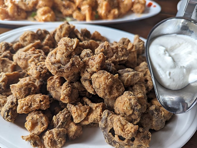 These aren't your average mushrooms—they're crispy, golden nuggets of happiness served with a cooling dip. Proof that sometimes the supporting acts deserve a standing ovation too.