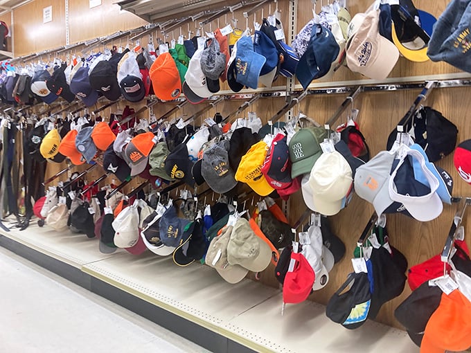 Baseball caps hanging like colorful stalactites in a cave of nostalgia. Each one tells a story—some you'd want to hear, others perhaps not.