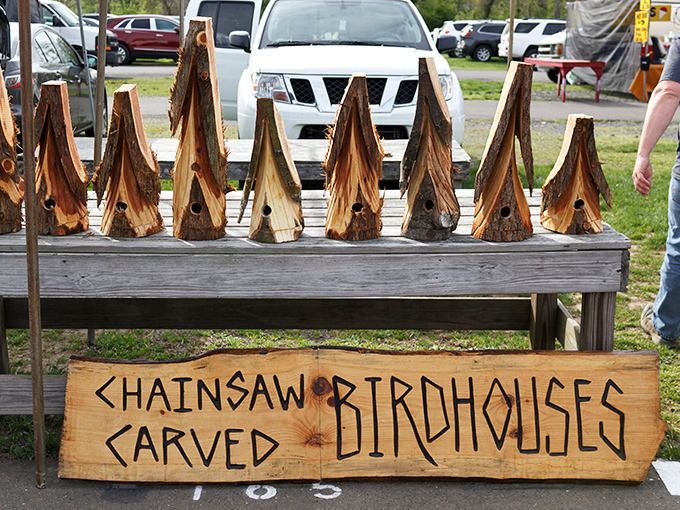 Rustic craftsmanship meets woodland whimsy in these chainsaw-carved birdhouses—proof that one person's fallen tree is another's feathered palace.
