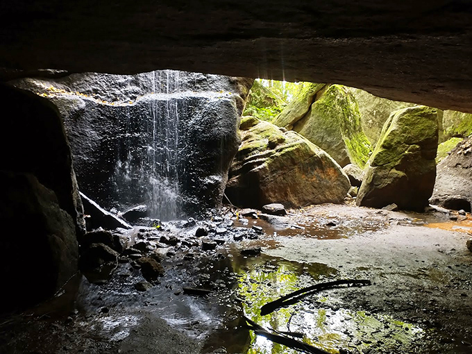 Indiana Jones would approve of this hidden grotto. Sunlight filters through the rock ceiling, turning an ordinary waterfall into something magical.
