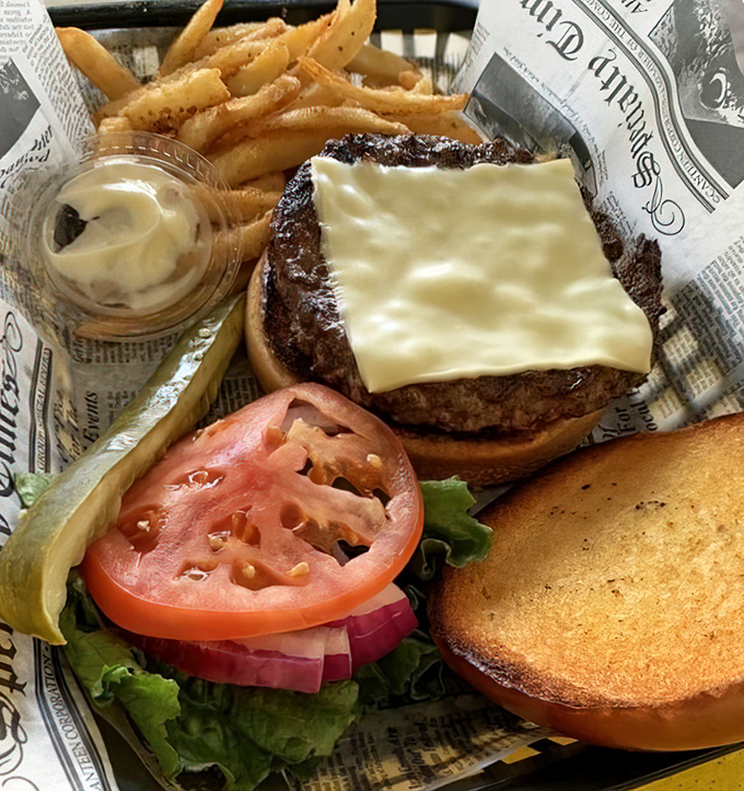 The star of the show! This cheeseburger doesn't need a fancy pedigree or artisanal backstory—it simply delivers pure, unadulterated pleasure.