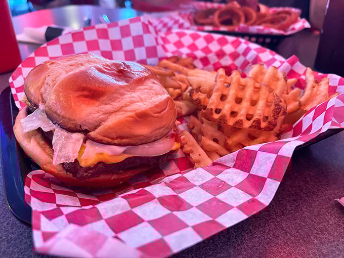 This isn't just a burger—it's edible architecture. The melty cheese cascading over a hand-formed patty creates the kind of sandwich that ruins all other burgers forever.