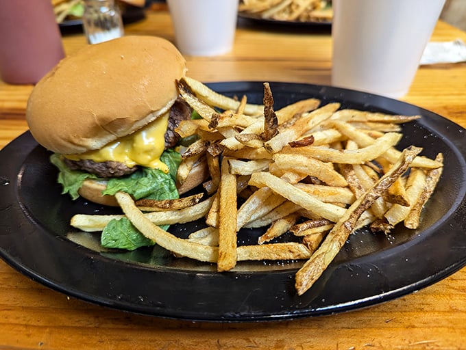This isn't just a cheeseburger—it's a manifesto of simplicity. Hand-cut fries that actually taste like potatoes flank a burger that needs no Instagram filter.