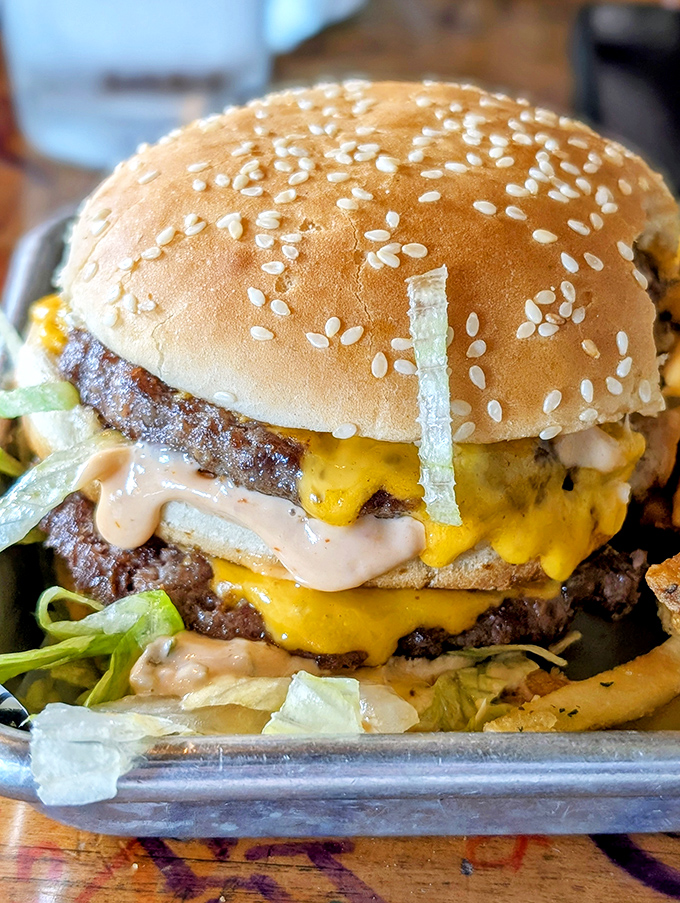 This isn't just a burger—it's an architectural marvel of beef, cheese, and special sauce that requires both hands and possibly a bib.