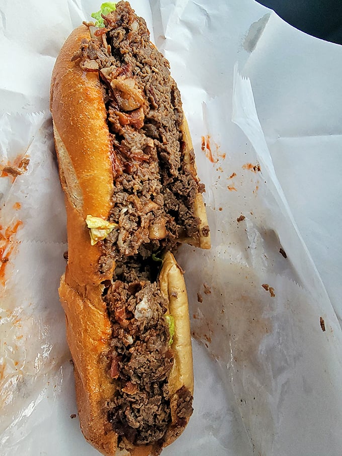 Behold the star attraction – layers of thinly sliced beef and melted cheese creating what can only be described as sandwich nirvana.