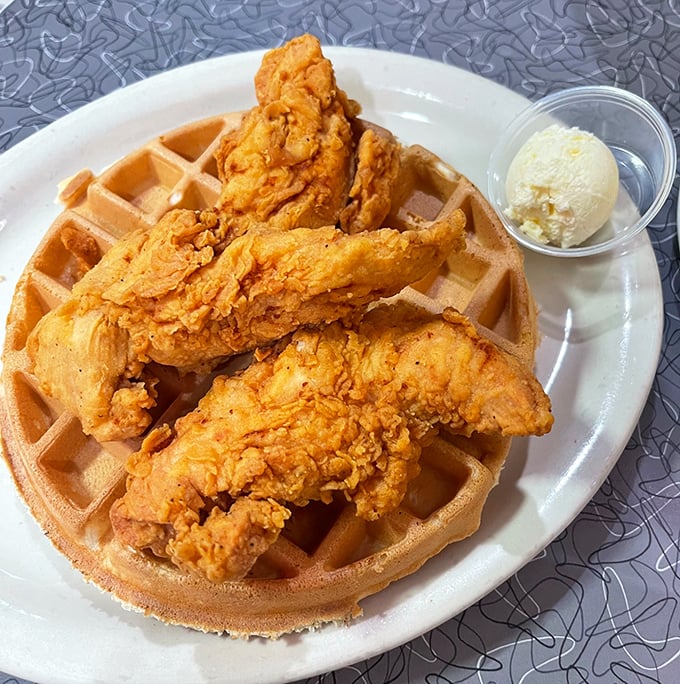 Chicken and waffles – the breakfast equivalent of a perfect marriage. Crispy golden chicken perched atop a fluffy waffle with a side of butter.