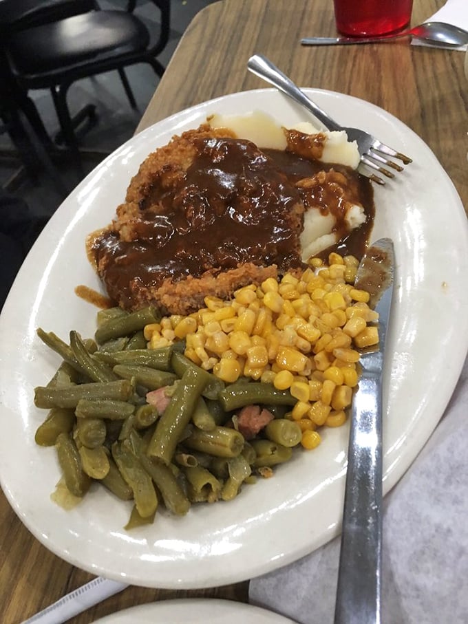 This isn't just chicken fried steak—it's a masterclass in comfort food engineering, with gravy cascading over crispy breading like a savory waterfall.