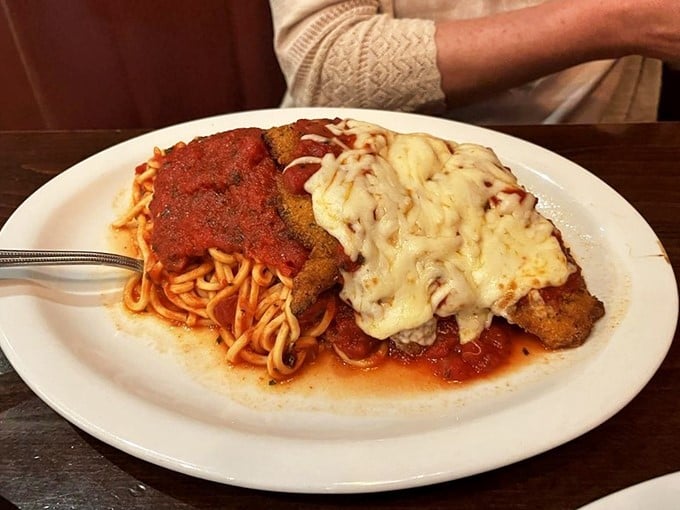 This chicken parmesan isn't just dinner—it's a commitment. The cheese pull alone deserves its own Instagram account and possibly legal representation.