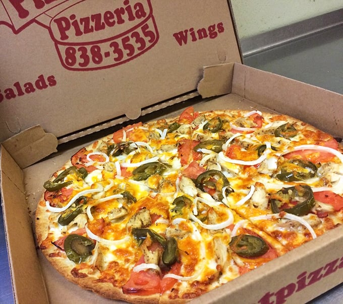 Jalapeños and fresh veggies dance across this vibrant specialty pizza. The colorful medley promises a flavor fiesta that bridges Italian tradition with Mexican flair.