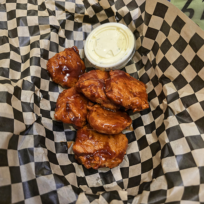 These aren't just wings—they're glistening flavor bombs that make you wonder if chickens evolved specifically to deliver this much joy to your taste buds.