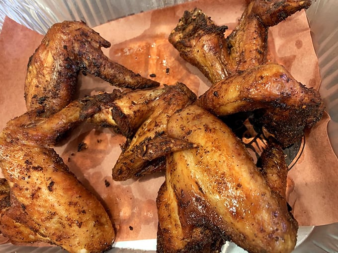 These hickory-smoked wings aren't just cooked, they're transformed—crispy exterior giving way to juicy meat that practically high-fives your taste buds.