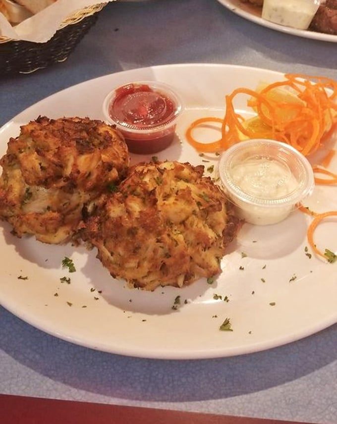 Behold the golden-crusted masterpiece that puts Broadway Diner on Baltimore's culinary map – pure crabmeat perfection on a plate.