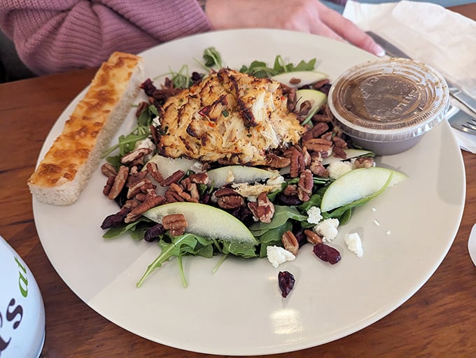 This isn't just any salad—it's a carefully orchestrated symphony of greens, nuts, and what appears to be crab cake, proving Pennsylvania knows its seafood game. 