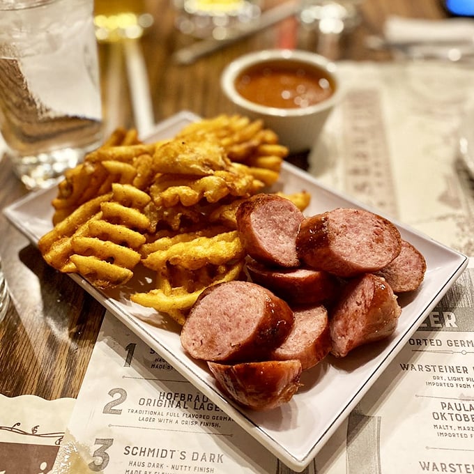 Sliced sausage and crispy waffle fries—proof that sometimes the simplest pleasures are the most satisfying. That dipping sauce is calling your name!