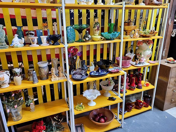 Colorful ceramics and glassware arranged with artistic precision – like a museum where everything has a price tag and a story to tell.