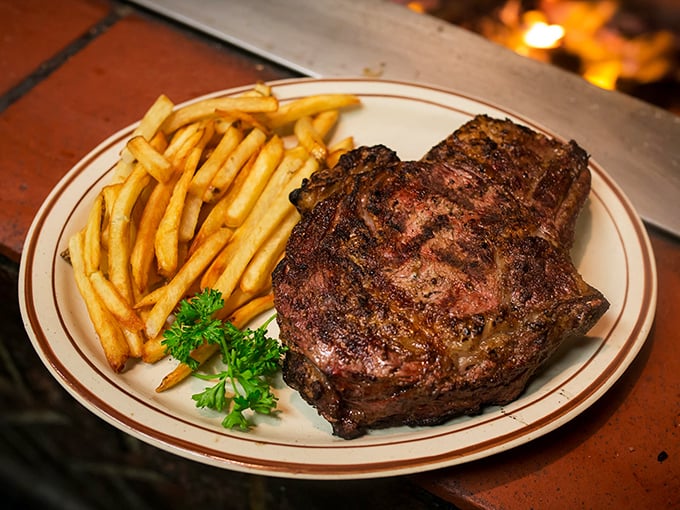 Behold the star of the show: a perfectly charred steak with golden fries. This isn't just dinner—it's the reason California cattle feel honored to be raised here.