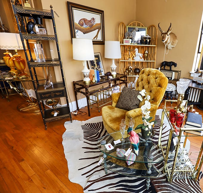 Safari meets sophistication in this eclectic corner. That mustard velvet chair is practically begging to hear your life story.
