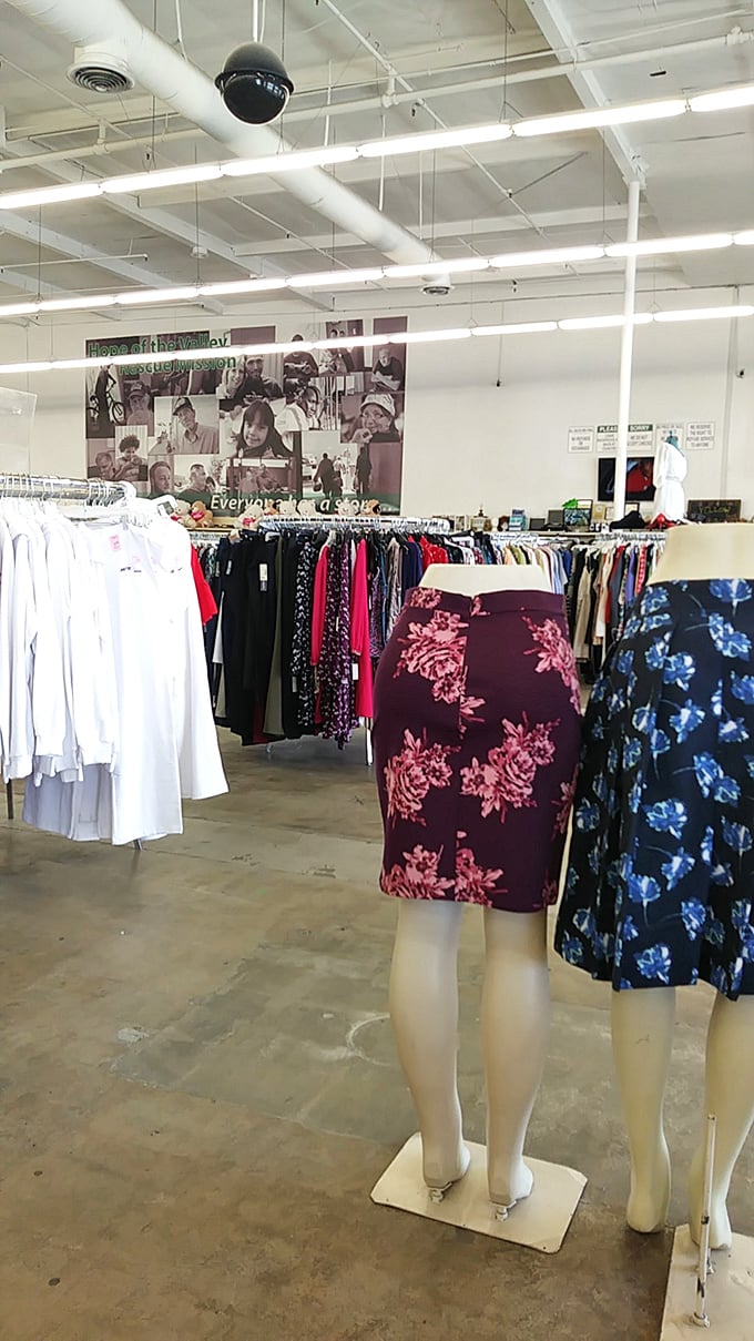 Mannequins sporting floral patterns stand sentinel over racks of carefully curated clothing—fashion's second chance at making first impressions.