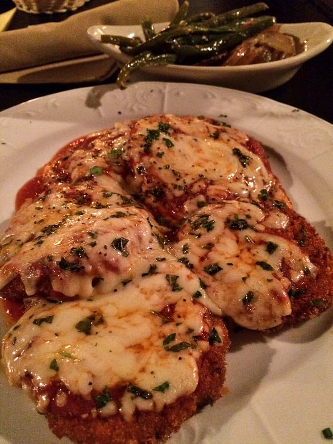 Eggplant parmigiana that doesn't just sit on the plate—it performs! Crispy exterior, melty cheese canopy, and that marinara singing backup.