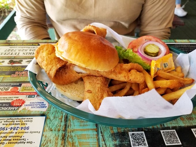 The legendary fish sandwich arrives like Poseidon himself prepared it—golden, crispy, and practically leaping off the bun.