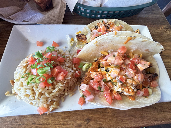 Fish tacos done right—simple, fresh, and colorful. That rice isn't just a side; it's the perfect supporting actor in this beachside production.