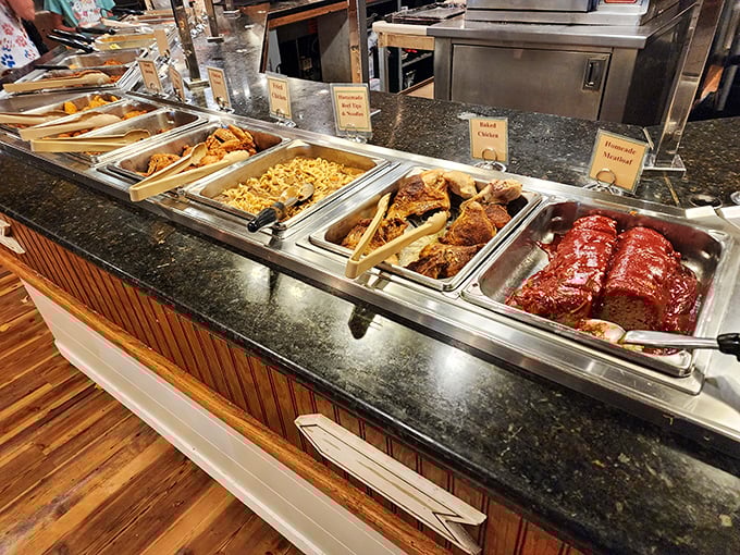 Behold the hot food line—where comfort classics stand at attention like delicious soldiers ready for the battle against your hunger.
