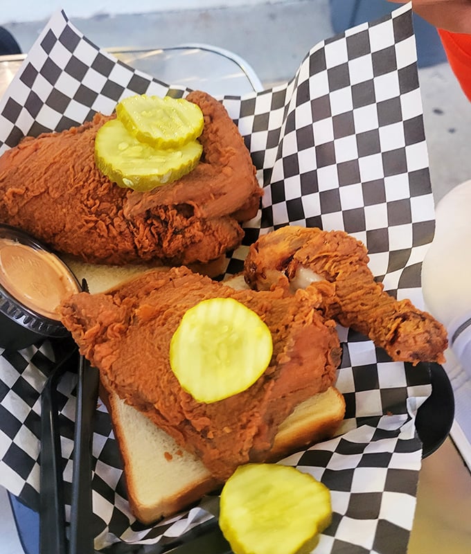 The bread is merely a vehicle for this glorious chicken. Those pickle slices aren't garnish – they're essential supporting actors.