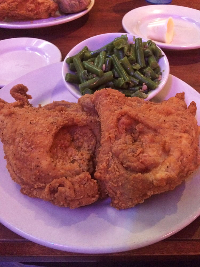 This isn't just fried chicken—it's edible architecture with a perfectly seasoned golden exterior protecting juicy meat that practically begs to be devoured.