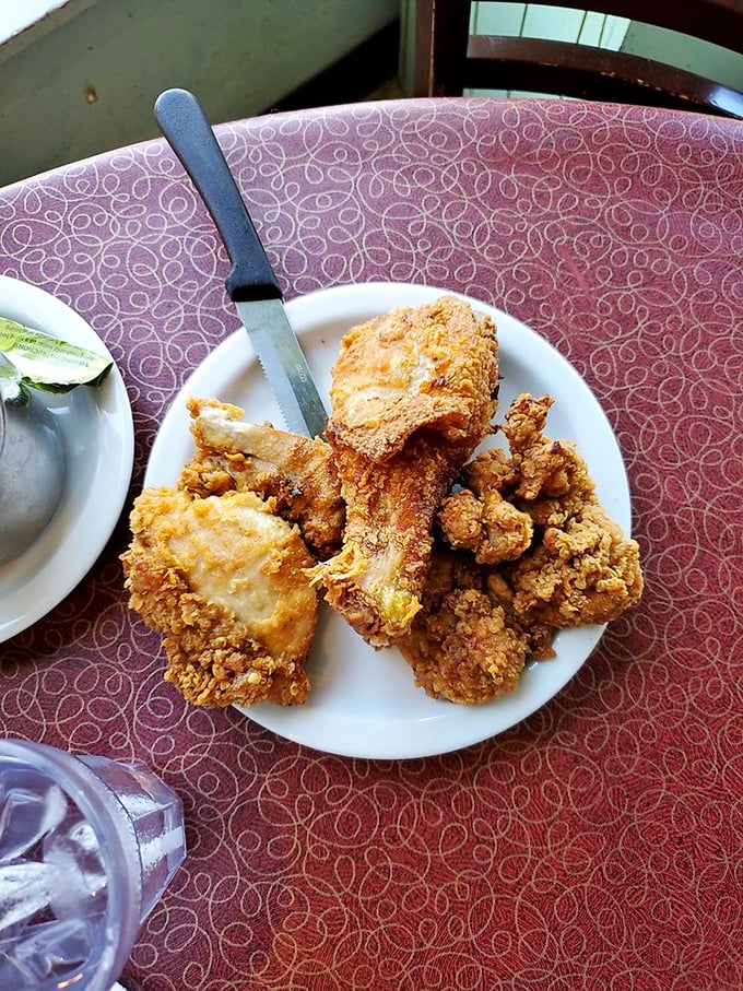 Golden-brown perfection on a plate. This fried chicken has the kind of crackling crust that makes a satisfying sound when your fork breaks through.