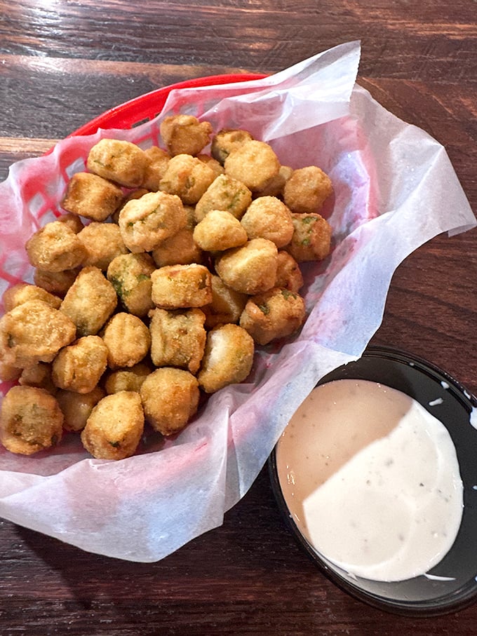 Golden-fried okra nuggets that crunch like nature's popcorn. The South's favorite vegetable transformed into a snackable masterpiece that disappears faster than Florida rain.