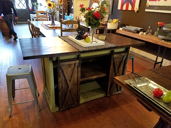 Farm-to-table gets a historical twist with this rustic island kitchen piece – barn doors included, no time machine necessary!