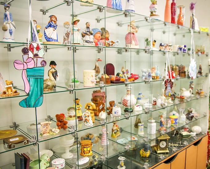 Collector's corner heaven! These glass shelves showcase figurines that once graced grandma's curio cabinet, now awaiting their second act in your home.