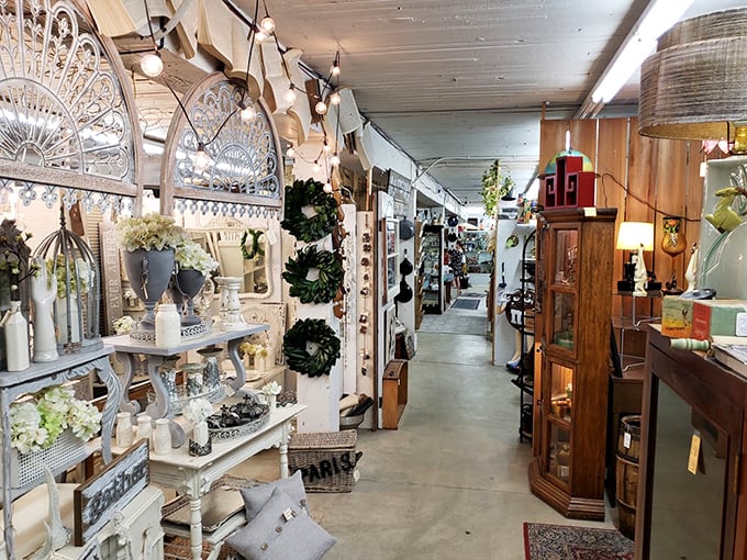 The farmhouse-chic corridor stretches before you like the yellow brick road of vintage decor—each booth a different aesthetic kingdom.