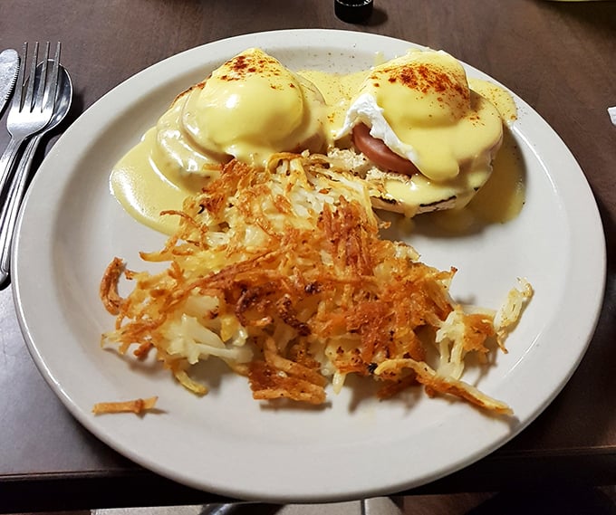 Eggs Benedict isn't just a breakfast, it's a commitment to excellence – perfectly poached eggs draped in hollandaise with hash browns crisped to golden perfection.