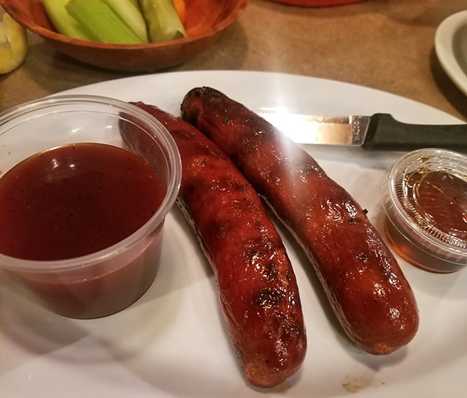 These hot links aren't just sausages; they're glistening ambassadors of smoke and spice, accompanied by their faithful sidekicks: barbecue sauce and honey.