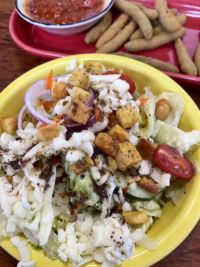 This isn't just any house salad—it's the opening act that somehow manages to steal some spotlight from the headliner. Those seasoned croutons deserve their own fan club.