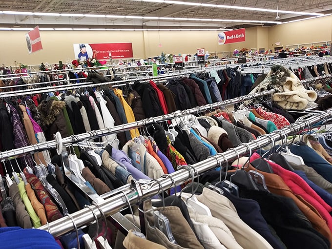 A forest of jackets where vintage leather neighbors last season's windbreakers, each with stories stitched into their seams.