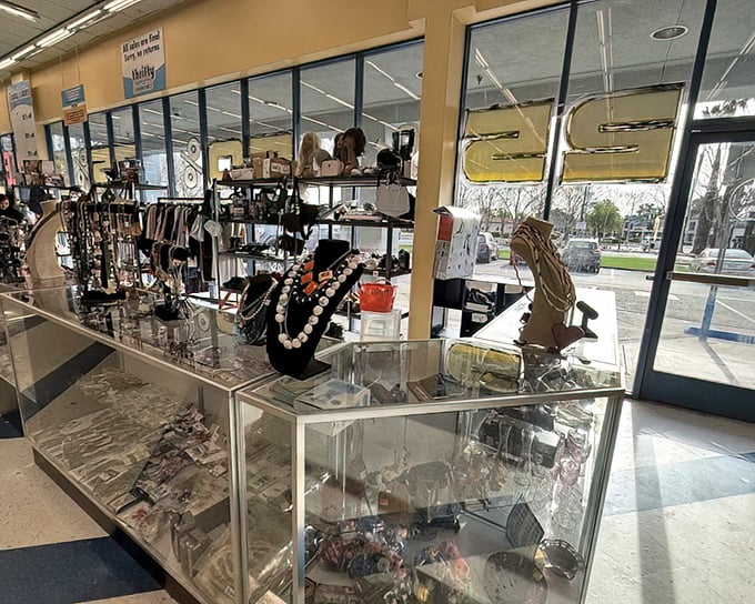 Behind glass cases, yesterday's accessories await tomorrow's special occasions. One person's forgotten necklace is another's conversation starter.