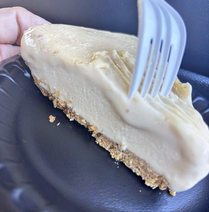 The pale yellow perfection of real key lime pie—no neon food coloring in sight. That graham cracker crust deserves a standing ovation.