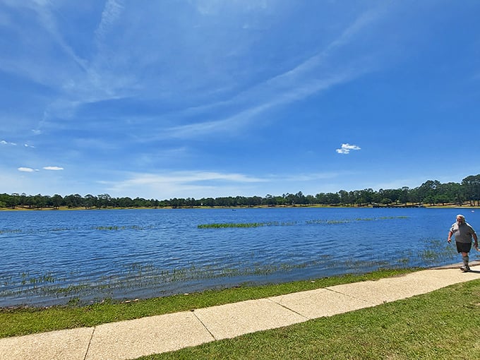 The lake's walking path offers a peaceful respite where locals exercise their bodies while the serene waters soothe their minds.