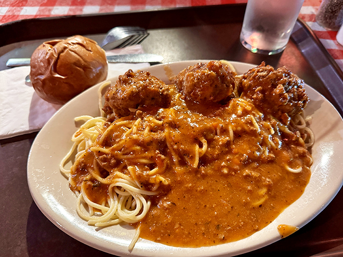 These meatballs aren't trying to be fancy—they're just doing what Italian grandmothers have known for centuries: smothering pasta in rich sauce creates happiness on a plate.