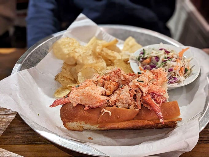 The famous lobster roll in all its glory—sweet meat barely dressed, nestled in a buttery roll. Simplicity that makes you wonder why anyone would complicate seafood.