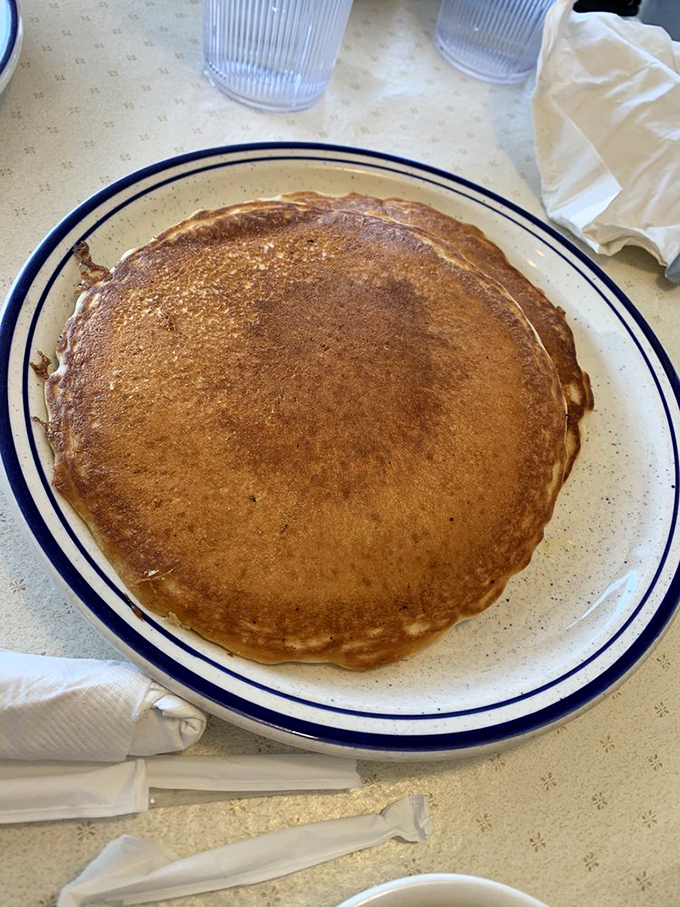 Behold the star attraction: a perfectly golden pancake that's achieved the holy grail of breakfast perfection - crisp edges, fluffy center.