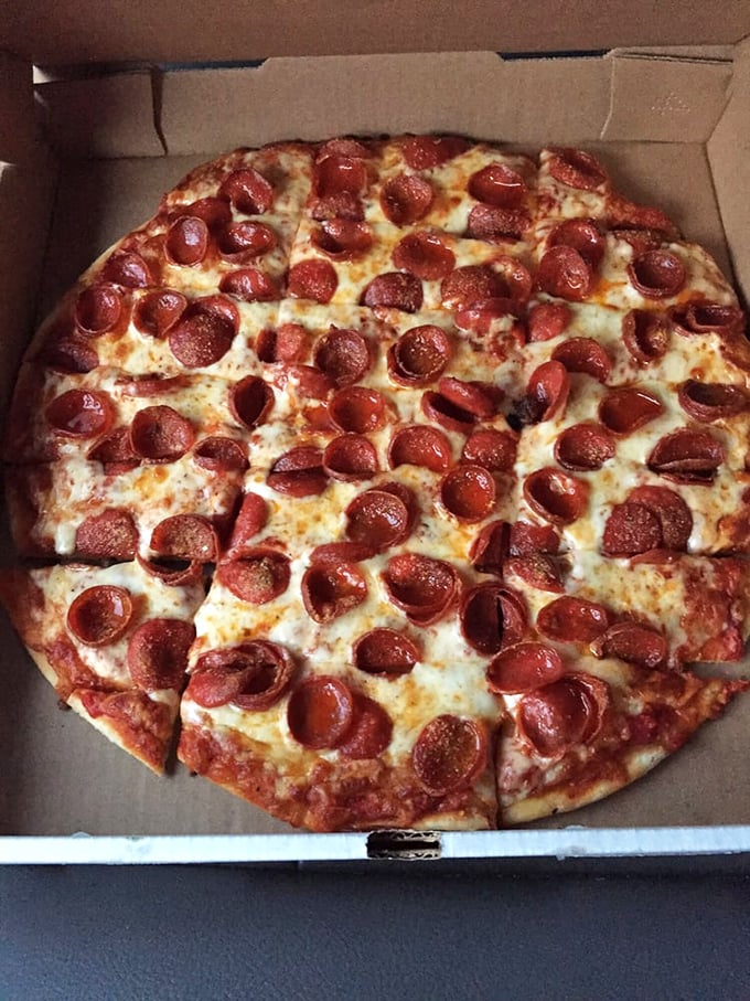 This isn't just pepperoni pizza – it's a masterclass in the art of proper topping distribution. Every bite guaranteed to deliver that perfect pepperoni punch.