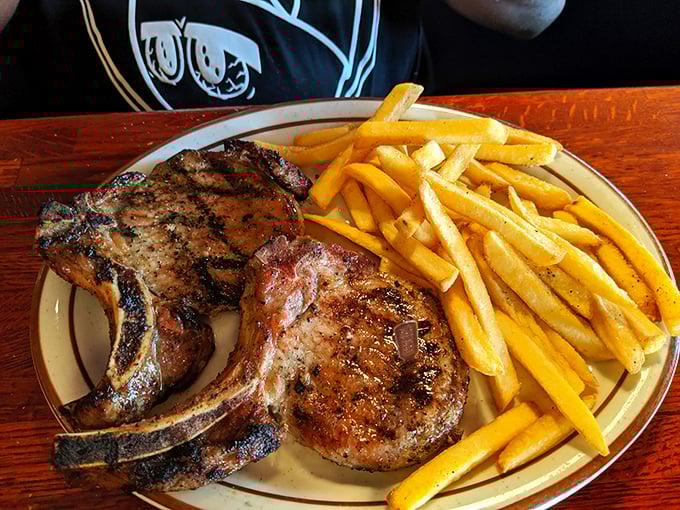 These pork chops have more sizzle than a Florida summer, paired with golden fries that could make a potato farmer weep with joy.
