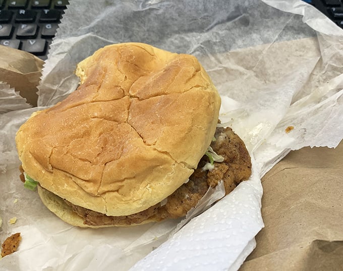 This isn't just a sandwich; it's a masterclass in simplicity—a perfectly seasoned pork tenderloin nestled in a soft bun that yields with each satisfying bite.