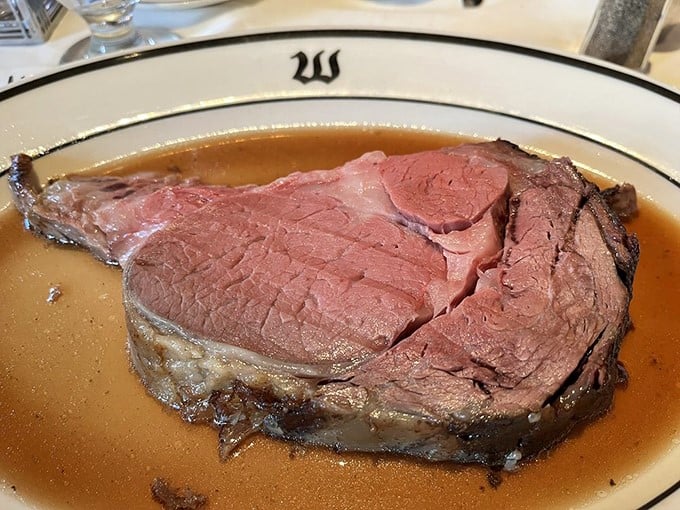 Behold the star of the show—prime rib so perfectly pink it makes other steaks jealous, swimming in an au jus that deserves its own fan club.