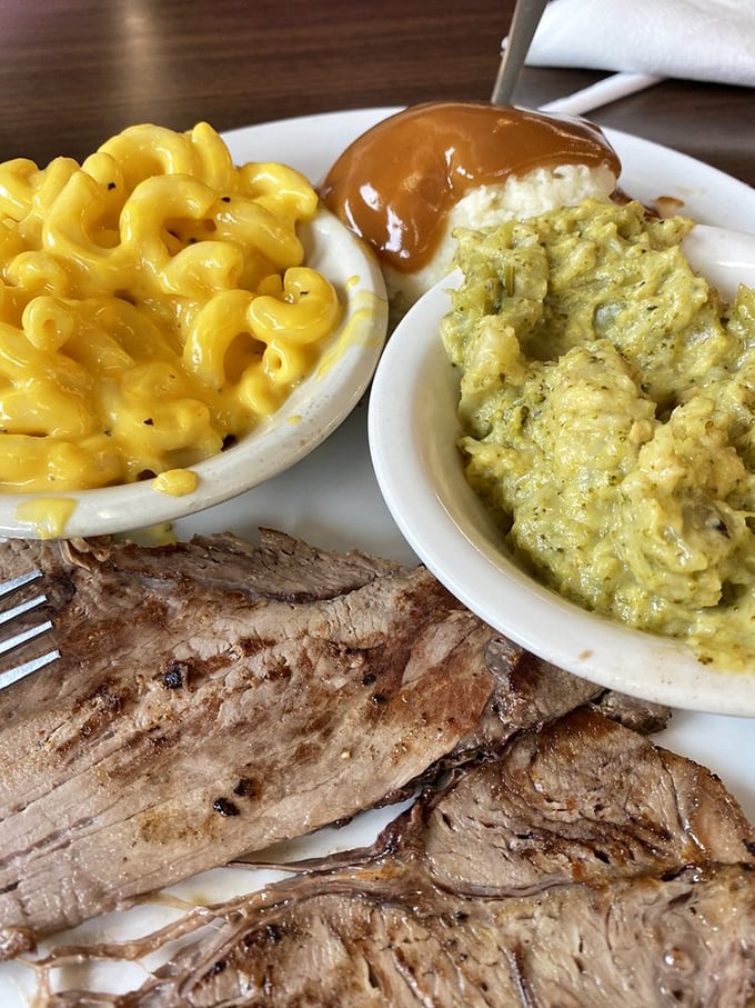 Meat and three heaven! This plate showcases Clyde's commitment to the art of perfectly executed comfort food—mac and cheese so yellow it could direct traffic. 